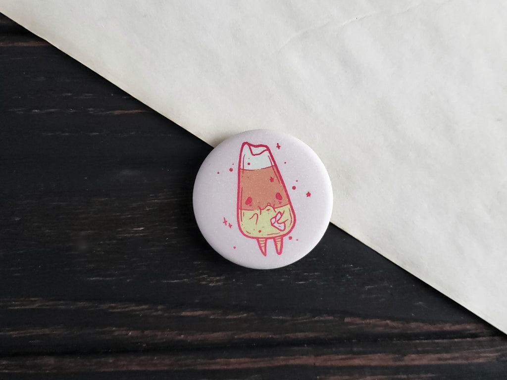 Candy Corn Creep pin badge – Paper Haunt / White Stag Art