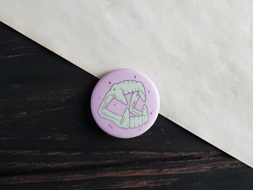 Green Vampire Fangs pin badge – Paper Haunt / White Stag Art